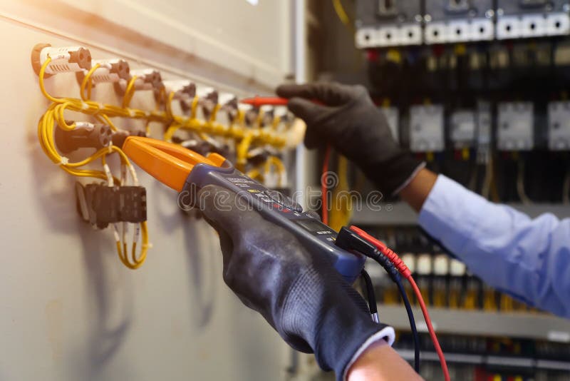 Electrical Engineer Using Digital Multi-meter To Check Current Voltage ...