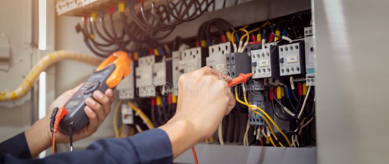 Electrical Engineer Using Measuring Equipment To Checking Electric ...