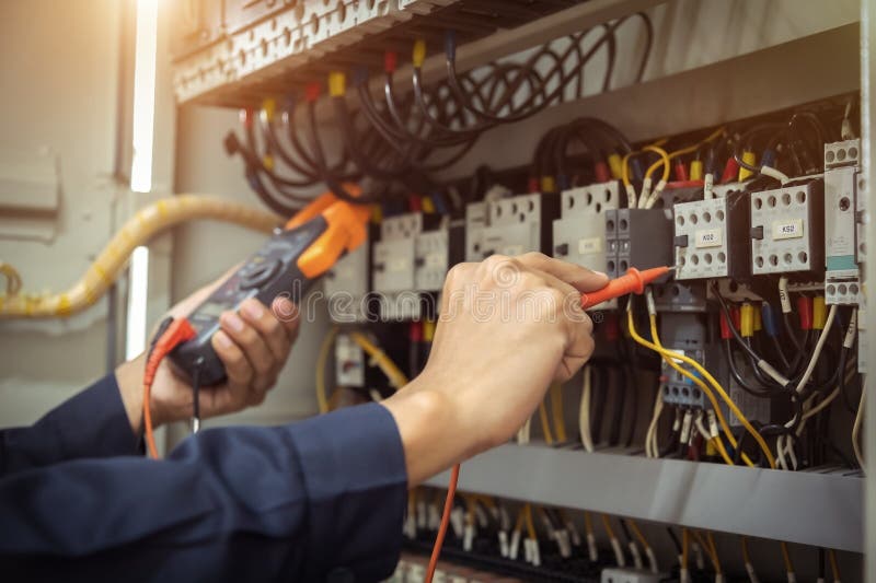 Electrical Engineer Using Measuring Equipment To Checking Electric ...