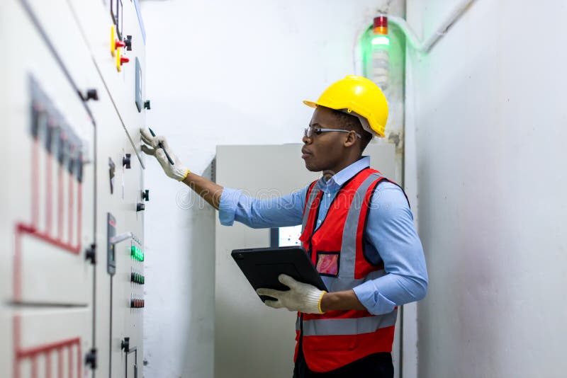Electrical Engineer Working in Control Room. Electrical Engineer Man ...