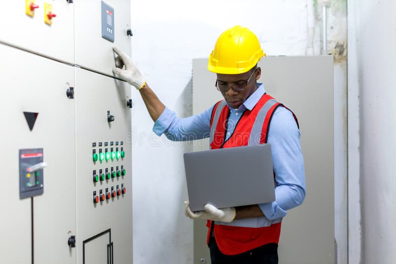 Electrical Engineer Working in Control Room. Electrical Engineer Man ...