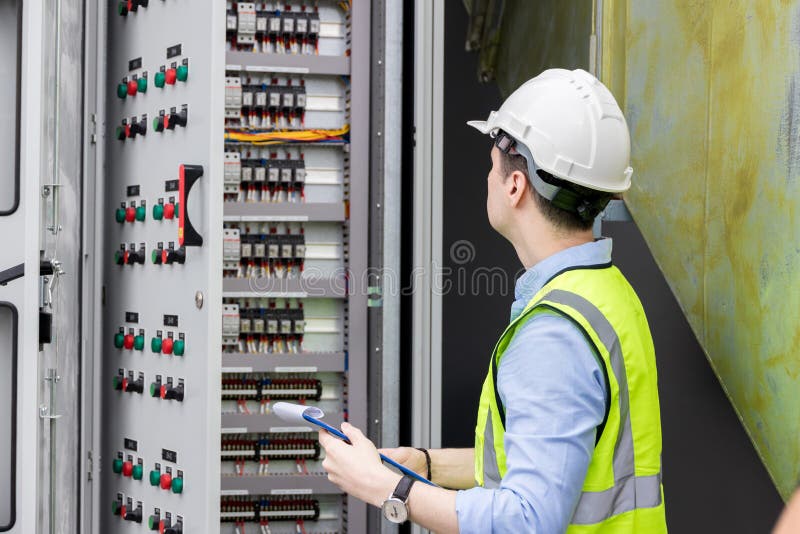 Electrical Engineer Working in Control Room. Electrical Engineer Man ...