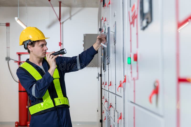 Electrical Engineer Working in Control Room. Electrical Engineer Man ...