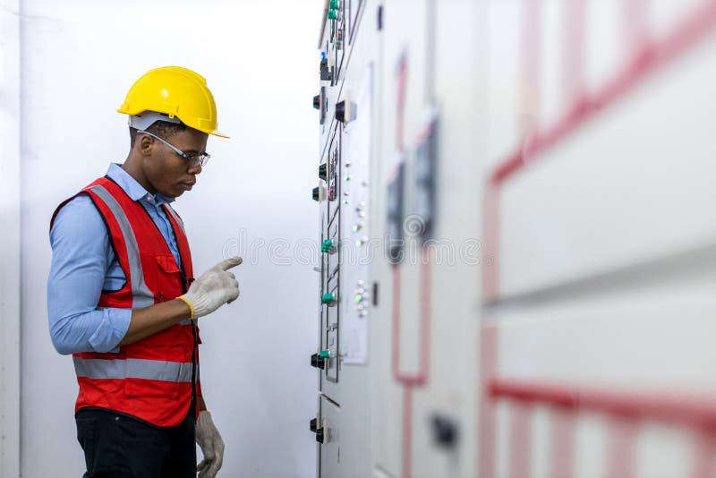 Electrical Engineer Working in Control Room. Electrical Engineer Man ...