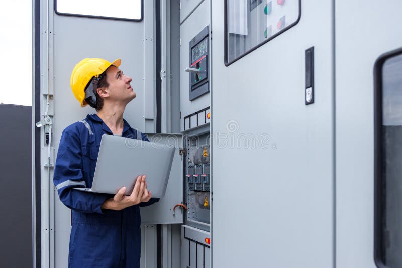 Electrical Engineer Working in Control Room. Electrical Engineer Man ...