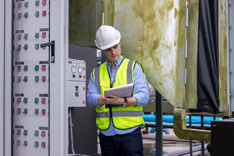 Electrical Engineer Working in Control Room. Electrical Engineer Man ...