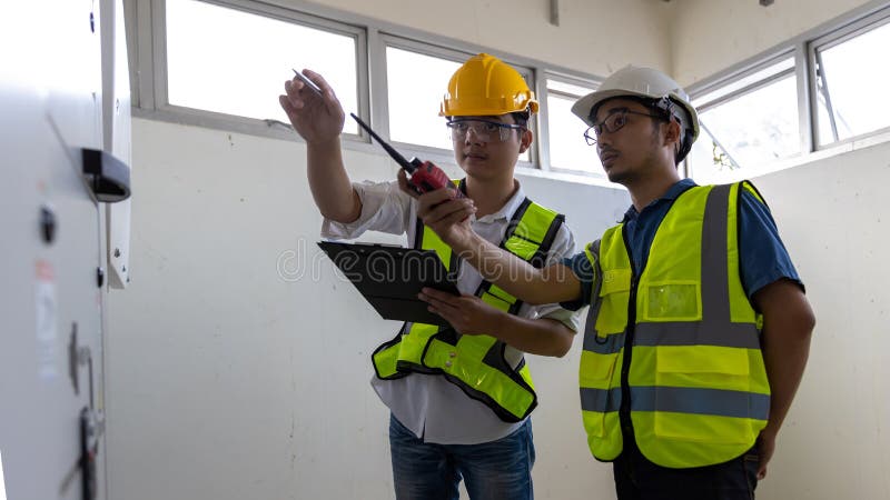 Electrical Engineer Working in Control Room. Electrical Engineer Man ...
