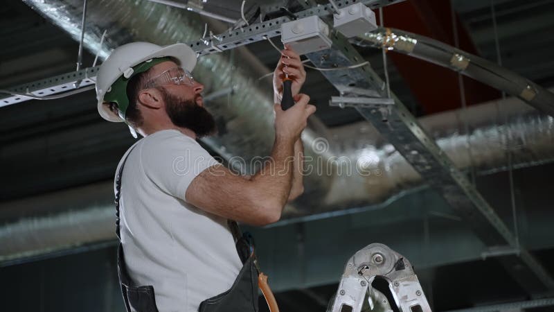 Electrical Engineer is Working, Installing Junction Box for Connecting ...