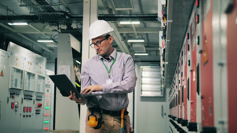 Electrical Engineer Checks the Work Done, Electrical Substation Stock ...
