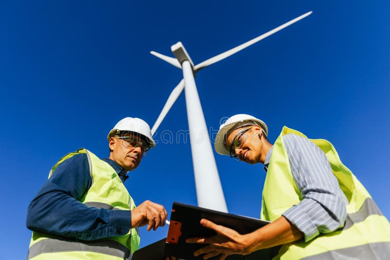 Electrical Engineer Working on Reports on a Wind Energy Farm. Stock ...