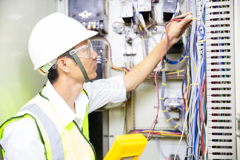 Electrical engineering man stock image. Image of installing - 247864561