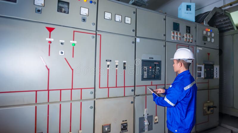 Electrical Engineers Check the Operation of the Main Electrical Control ...