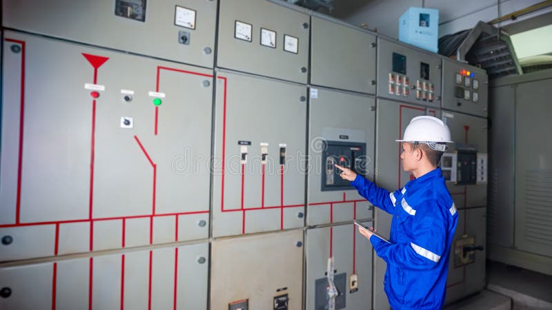 Electrical Engineers Check the Operation of the Main Electrical Control ...