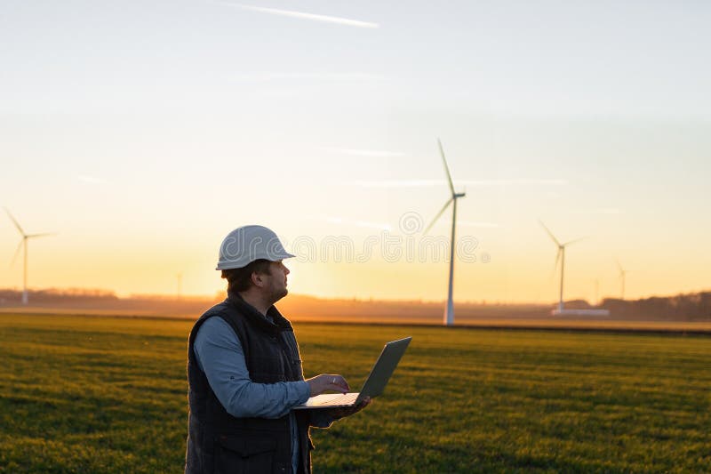 Electrical Engineers Working at Wind Turbine Power Generator Station ...