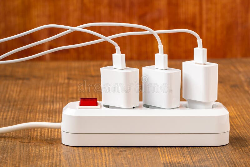 The Electrical Extension Strip with Connected White Power Plugs on the ...