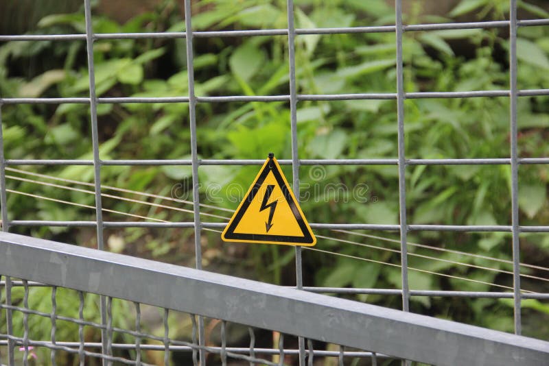 Electrical Fence Warning Sign Stock Photo - Image of isolation, cage ...