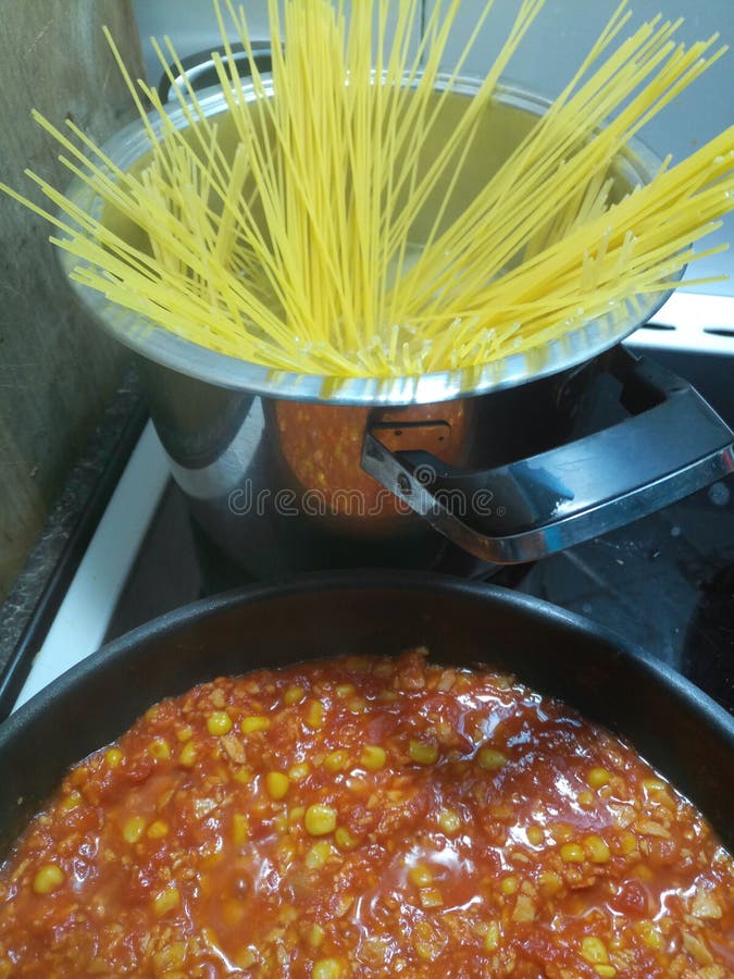 Uncooked Spaghetti Sticks in a Pot with Diced Ham Cooking G Stock Photo ...