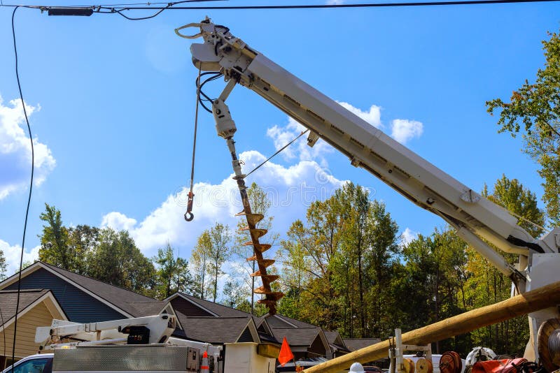 Electrical Infrastructure is Being Upgraded by Worker in a Raised ...