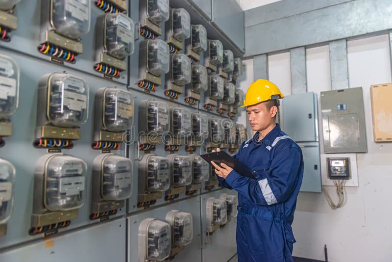 Electrical Maintenance Engineer is Checking .Electricity Meter, Main ...