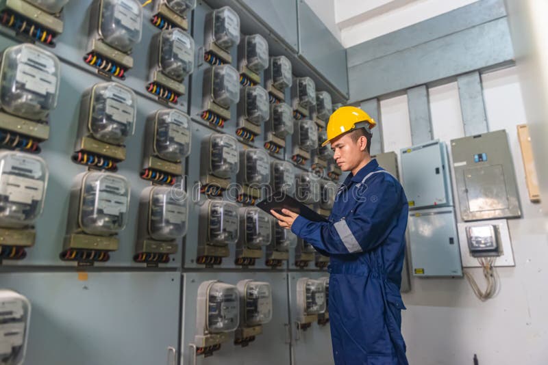 Electrical Maintenance Engineer is Checking .Electricity Meter, Main ...