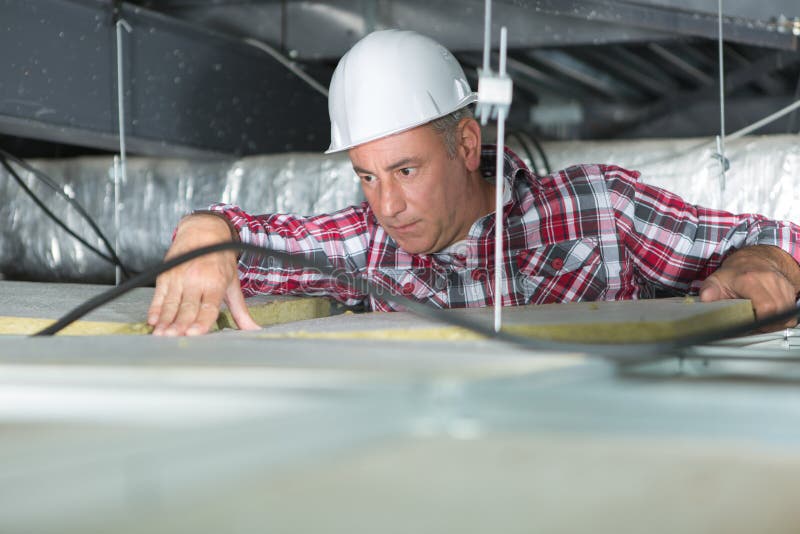 Electrical Maintenance Worker Checking Cables on Ceiling Stock Photo ...