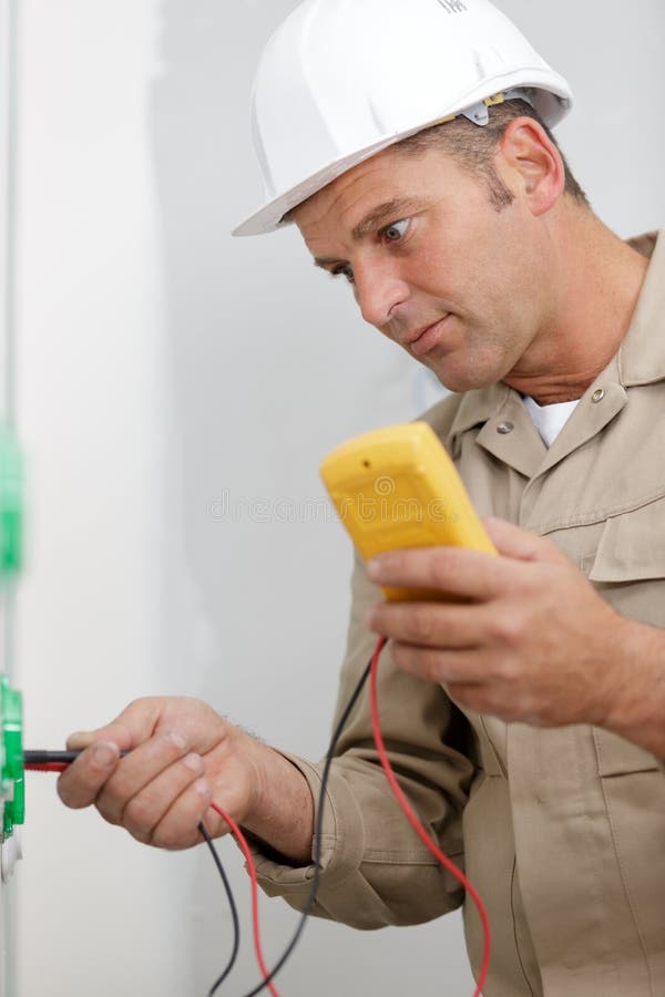 Electrical Man Checks Phase Rottation for High Voltage Cable Stock ...