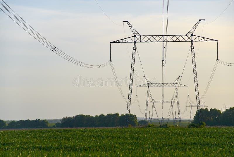 Electrical Net on Background of Sky and Green Field Stock Photo - Image ...