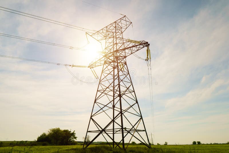 Electrical Net of Poles on a Panorama of Blue Sky and Green Meadow ...