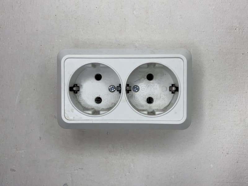 Electrical Outlet with Cord on Plain Grey Background for Minimalistic ...