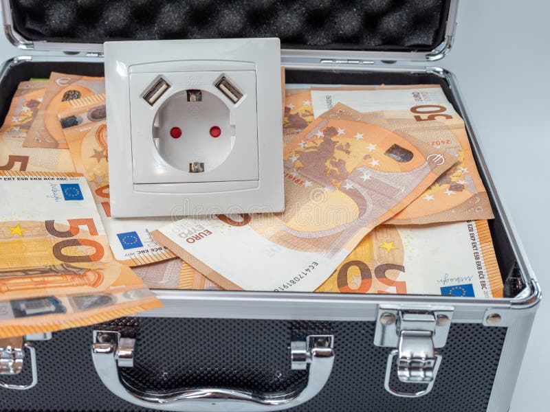 The Electrical Outlet is in a Suitcase with Money. Stock Photo - Image ...