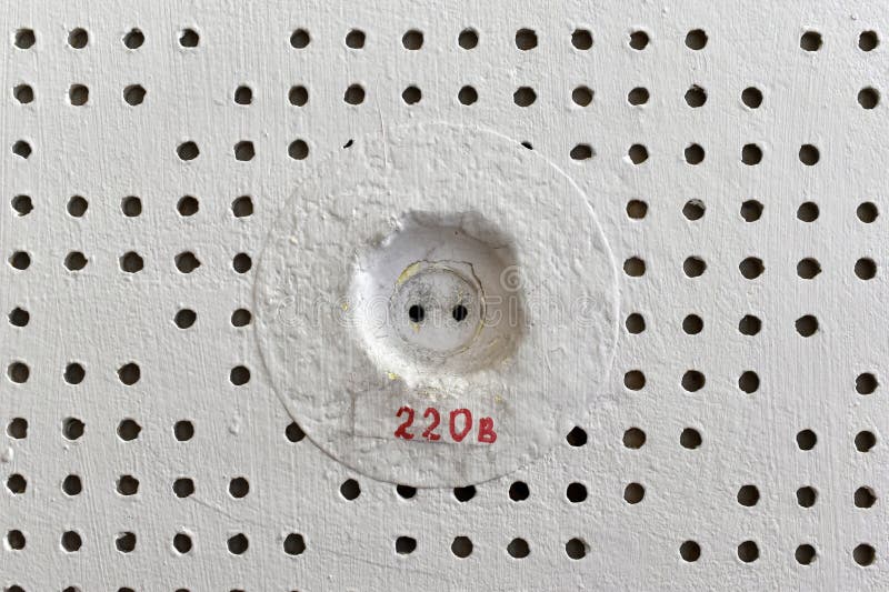 An Electrical Outlet in the Wall. a Wall with Holes Stock Photo - Image ...