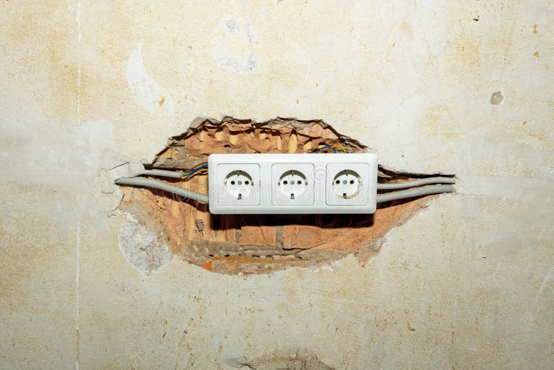 Electrical Outlet in the Wall of an Old House, Closeup Stock Photo ...
