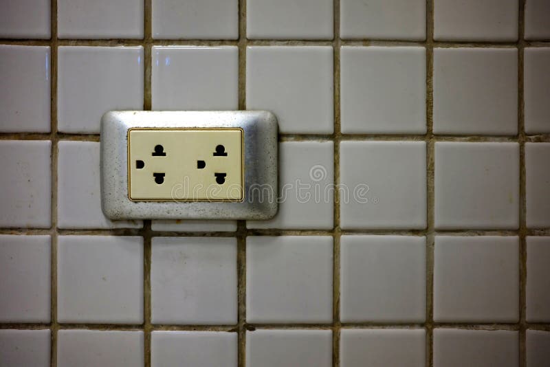 Electrical Outlet with White Ceramic Tile Wall. Stock Image - Image of ...