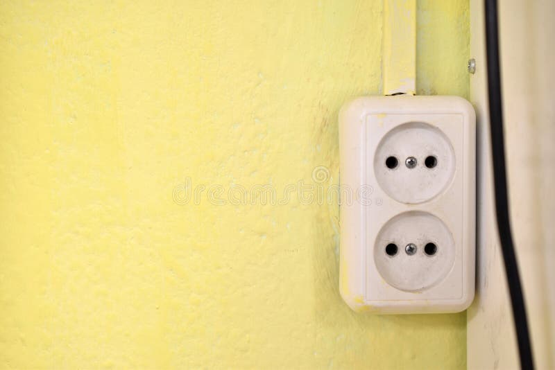 Electrical Outlet on the Yellow Wall in the House Stock Photo - Image ...