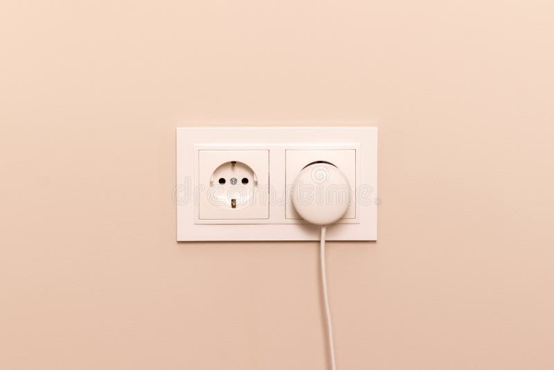 Electrical Outlets with Plug on Beige Wall Stock Photo - Image of house ...
