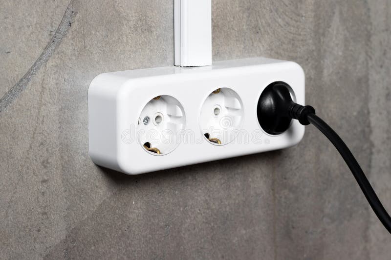 Electrical Outlets with Plug on Concrete Wall Stock Photo - Image of ...