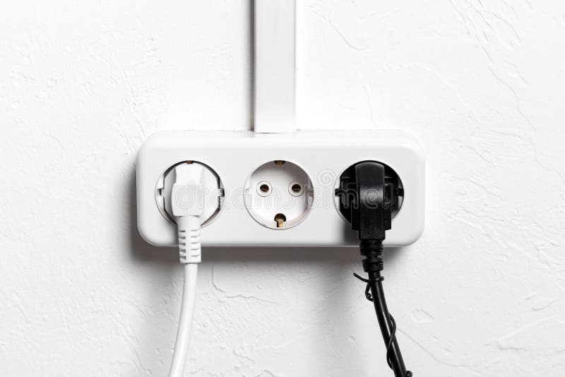 Electrical Outlets with Two Plugs on White Wall Stock Image - Image of ...