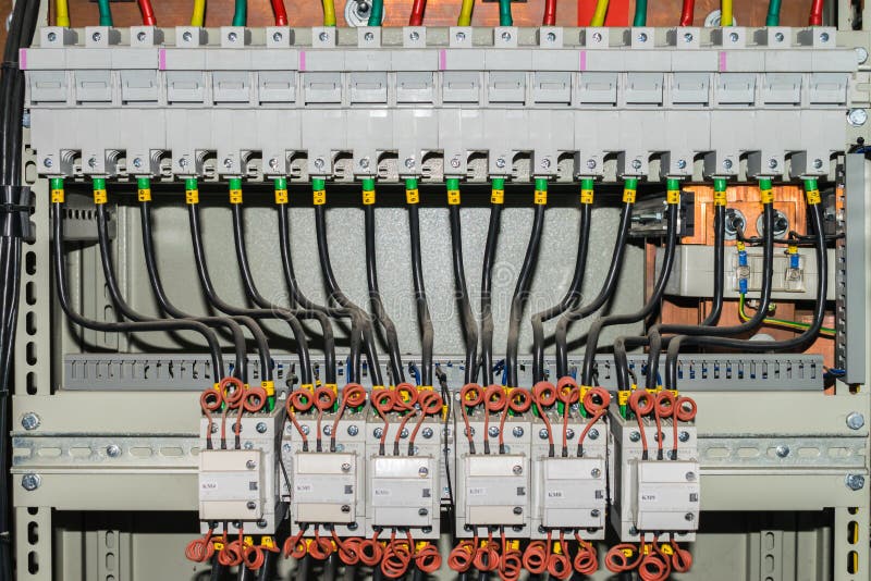 Electrical Panel with a Lot of Wires and Switches. Cabling is Connected ...