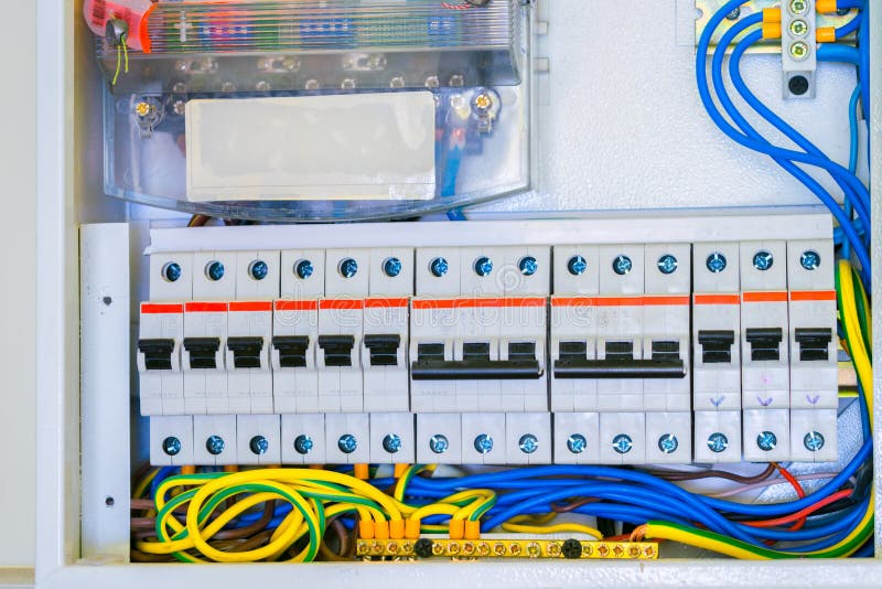 Electrical Panel with a Lot of Wires and Switches. Cabling is Connected ...