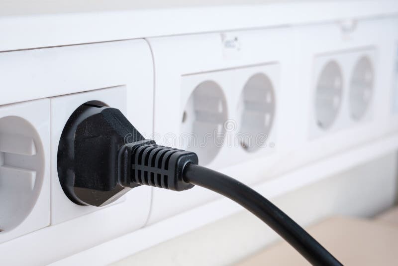 Electrical Plug from Operating Equipment in the Outlet Stock Photo ...