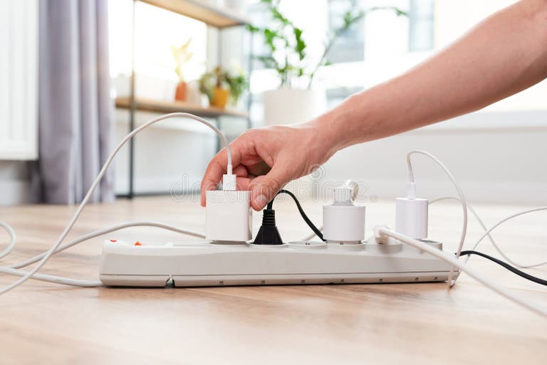 Electrical Plug in Outlet Socket at Home Stock Photo - Image of device ...