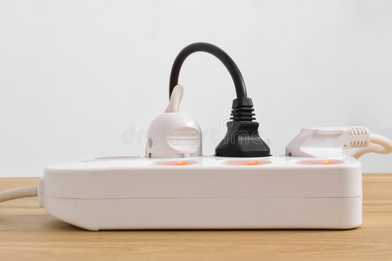 Electrical Plug in Outlet Socket at Home Isolated on on Wooden Table ...