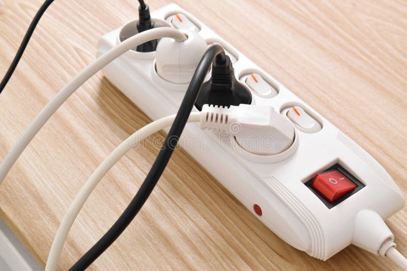 Electrical Plug in Outlet Socket at Home Isolated on on Wooden Table ...