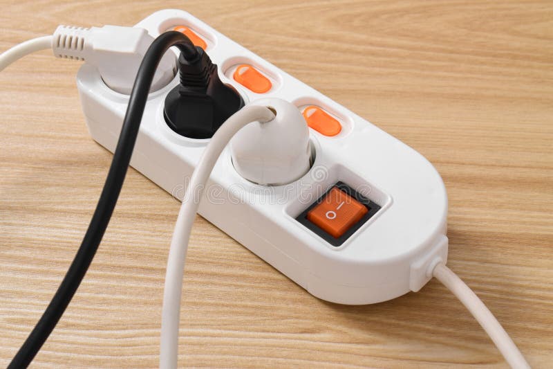 Electrical Plug in Outlet Socket at Home Isolated on on Wooden Table ...