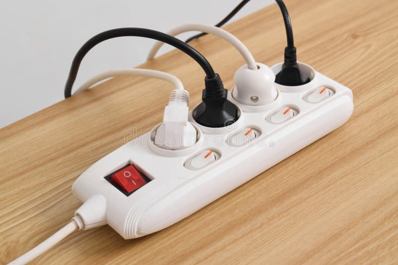 Electrical Plug in Outlet Socket at Home Isolated on on Wooden Table ...