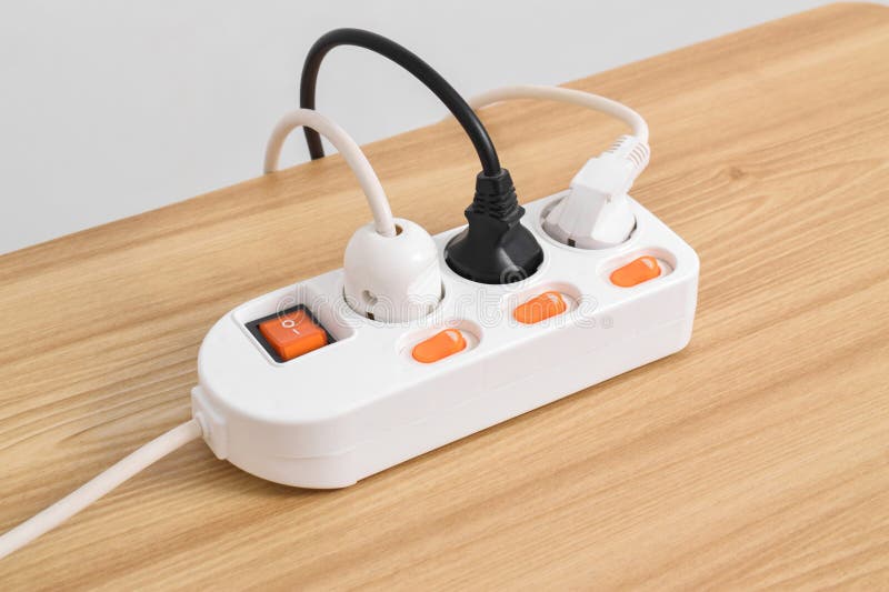 Electrical Plug in Outlet Socket at Home Isolated on on Wooden Table ...
