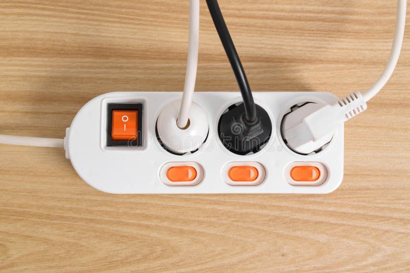 Electrical Plug in Outlet Socket at Home Isolated on on Wooden Table ...