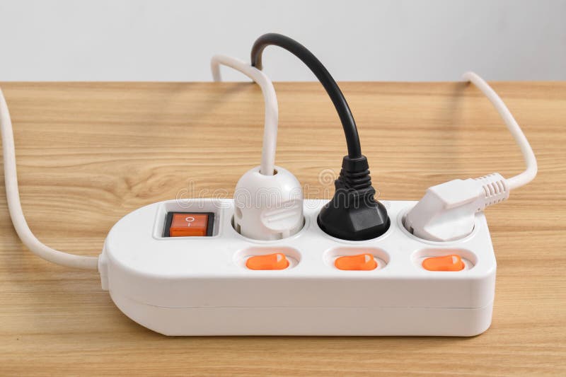 Electrical Plug in Outlet Socket at Home Isolated on on Wooden Table ...