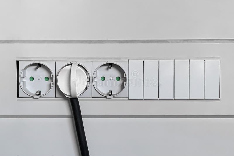Electrical Plug is Plugged into the Wall Outlet Close-up Stock Image ...
