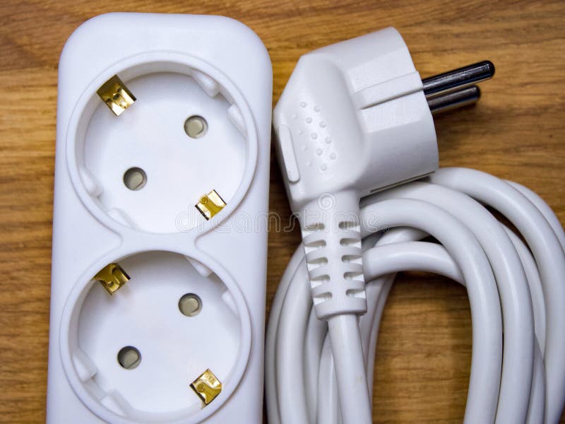 Electrical Plug and Socket on Wood, Showcasing a Concept of Power ...
